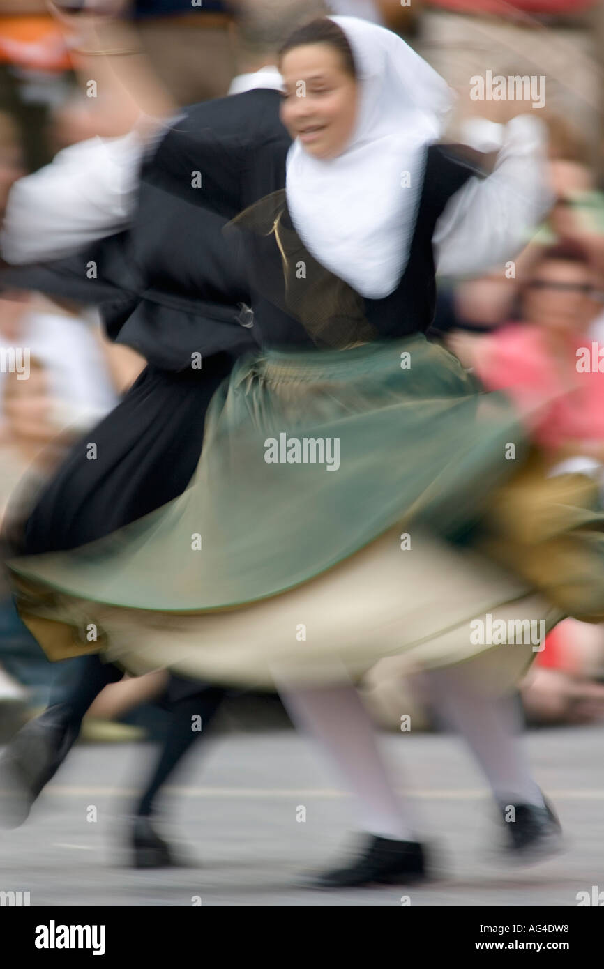 Female Spanish folk dancer in traditional dress performing before ...