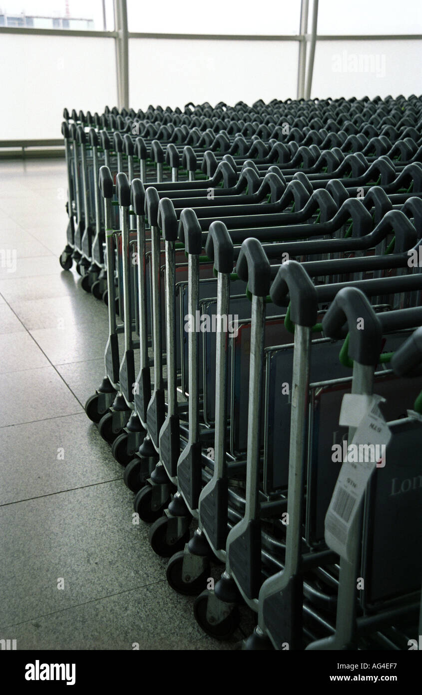 Luggage trolleys at an airport Stock Photo - Alamy