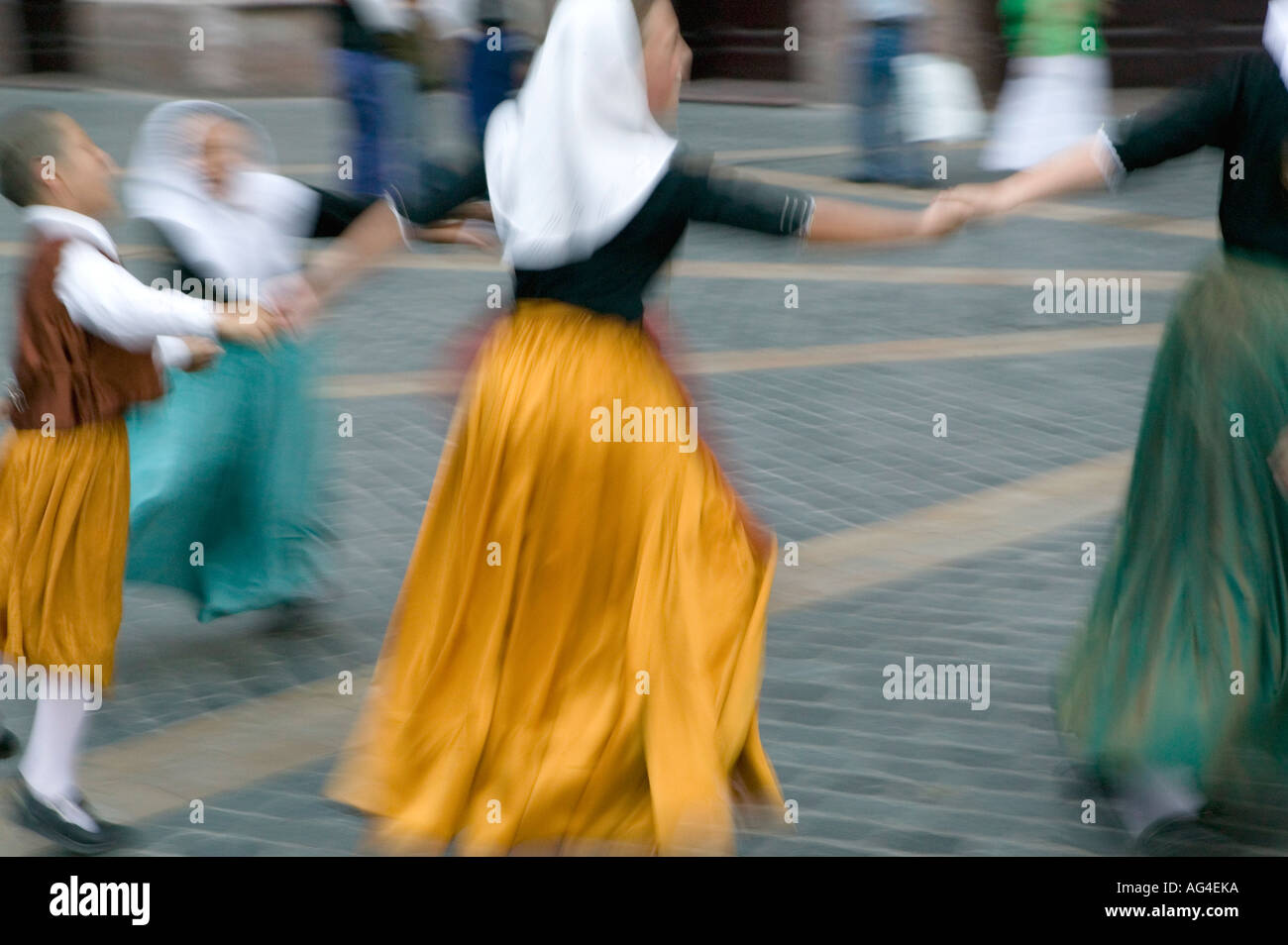 Several Spanish children dancing with the Escalfits Castenyetes dance ...