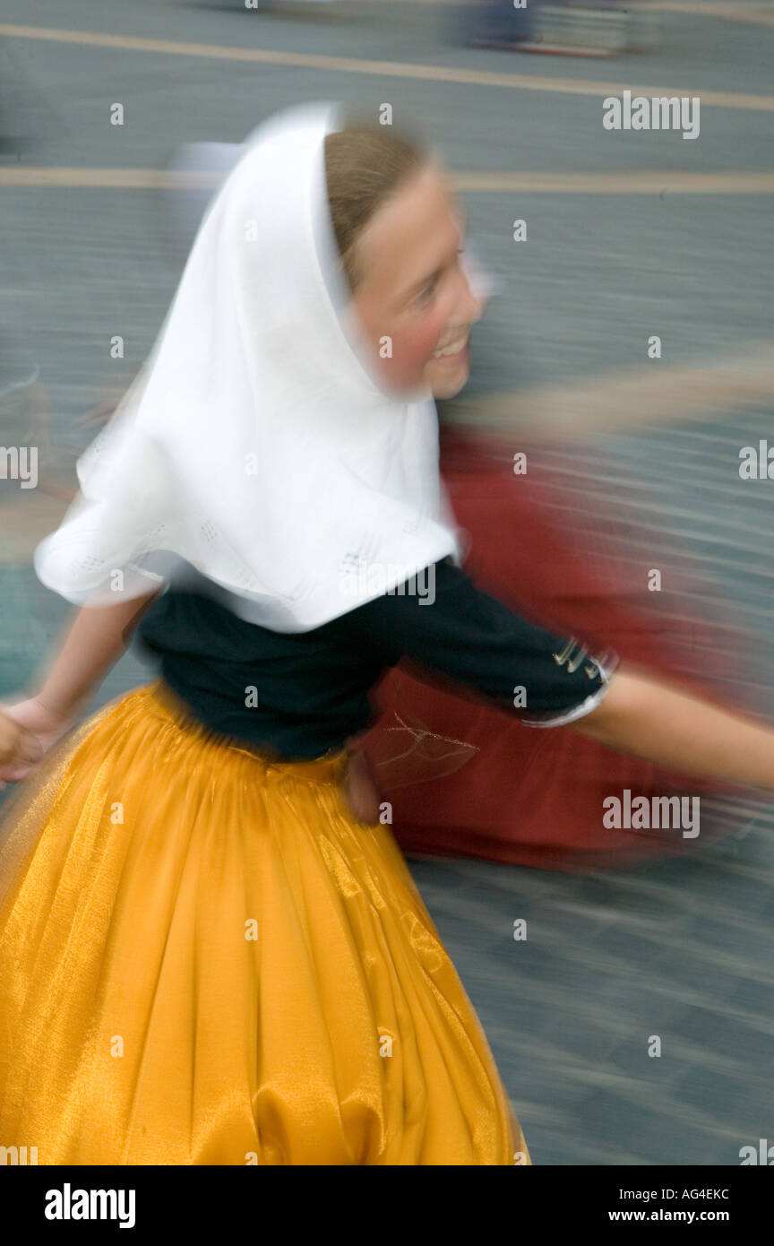 Spanish girl in yellow skirt dancing with the Escalfits Castenyetes ...