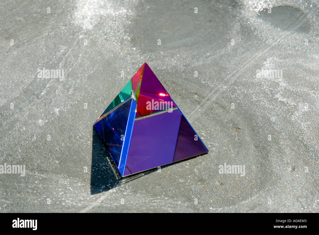 Glass pyramid on rock Stock Photo - Alamy