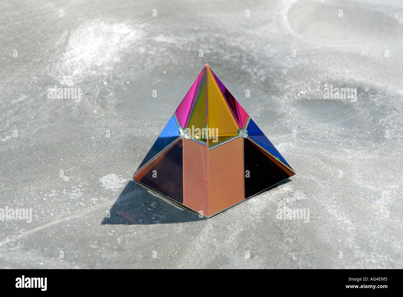 Glass pyramid on rock Stock Photo - Alamy
