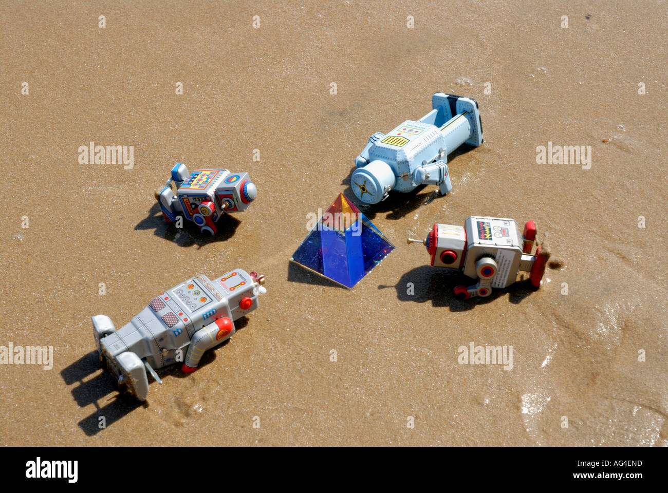 Four robots on the beach Stock Photo - Alamy