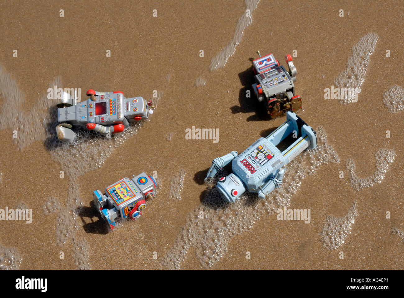 Four robots on the beach Stock Photo - Alamy