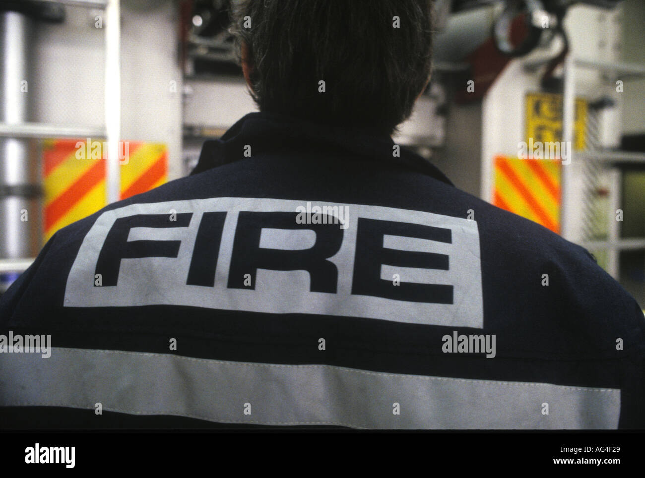 The back of a fireman in front of a fire engine at Kingsland Road Fire ...