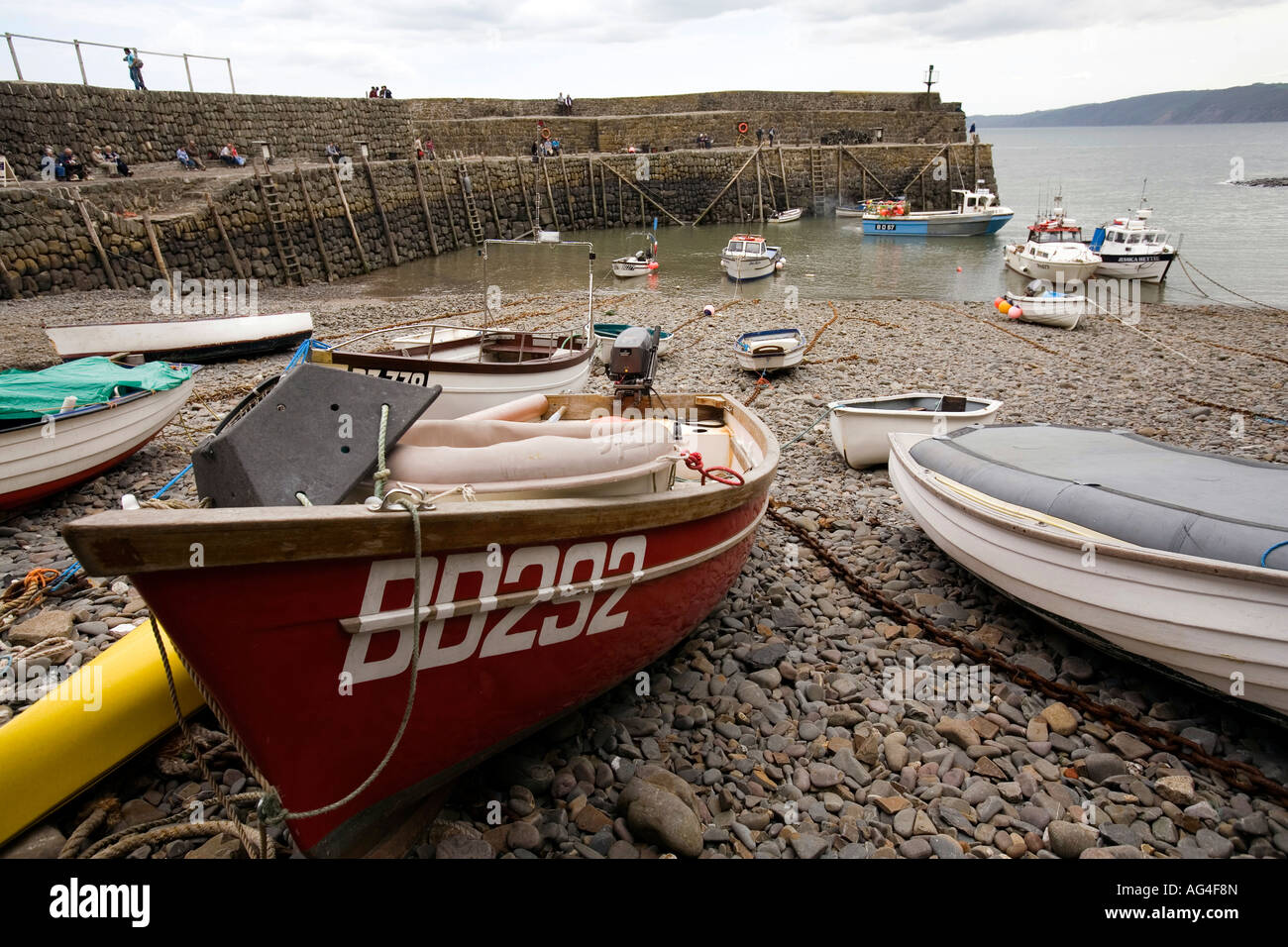 UK Devon Clovelly harbour boats at low tide Stock Photo - Alamy