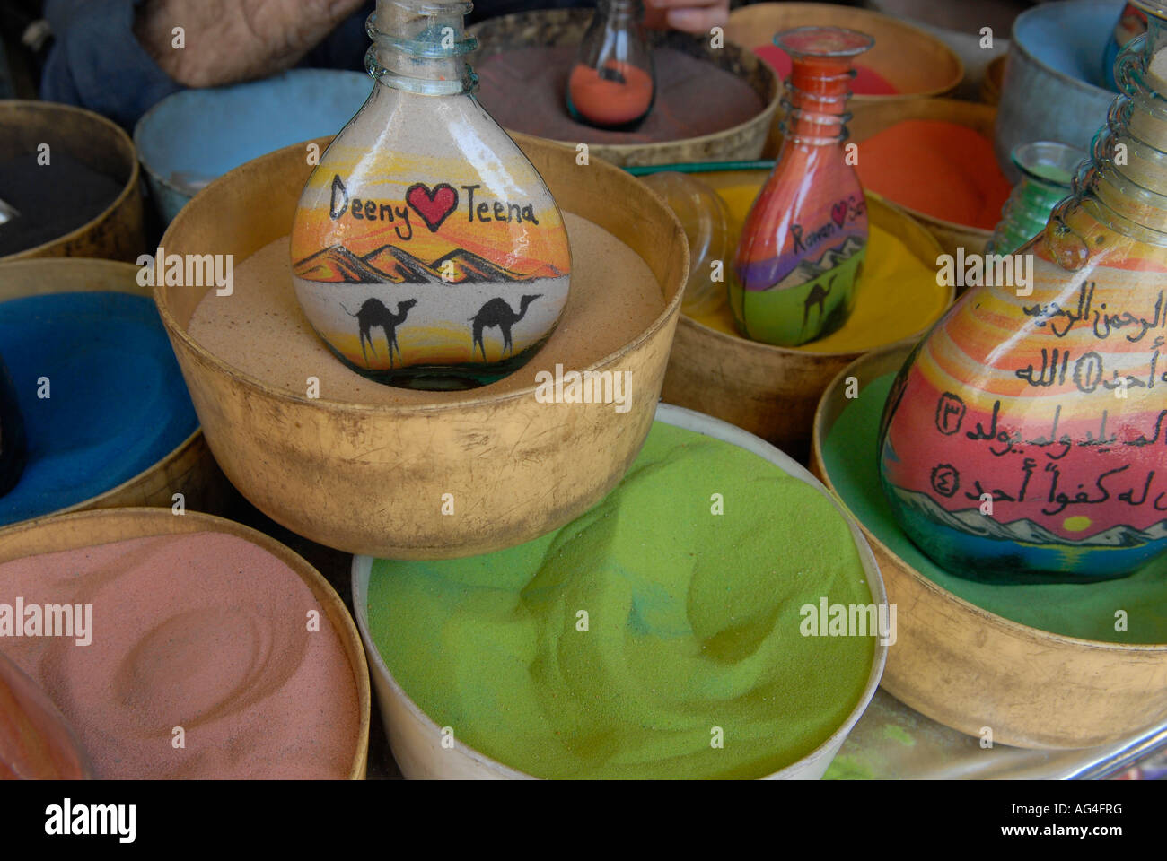 Stack of sand bottles with different kinds of coloured sand taken from ...