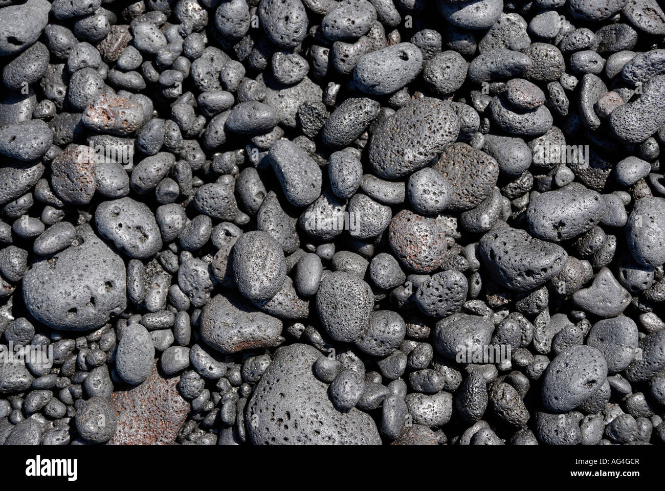 Volcanic rock pebbles Stock Photo - Alamy