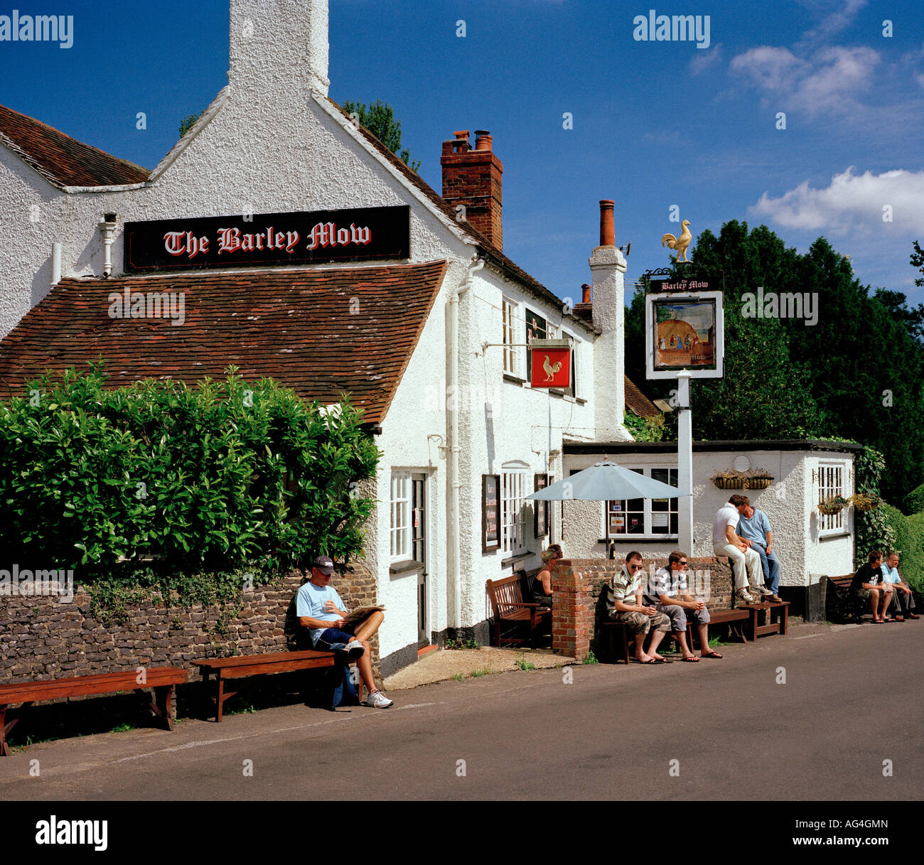 People enjoying a drink outside The Barley Mow public House, Tilford ...