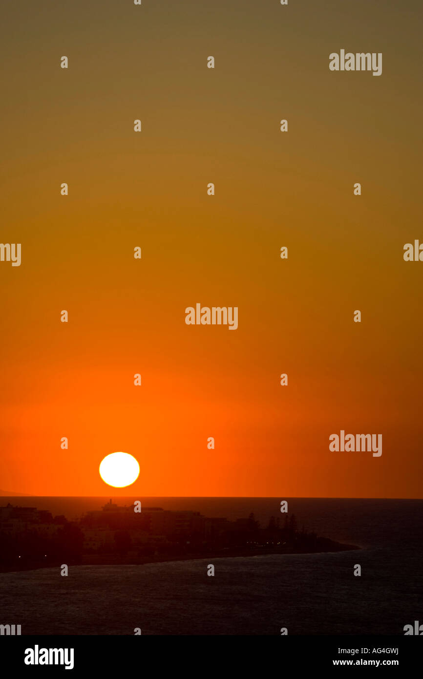 The sun setting over Trianta Bay and the town of Ixia on the Greek ...