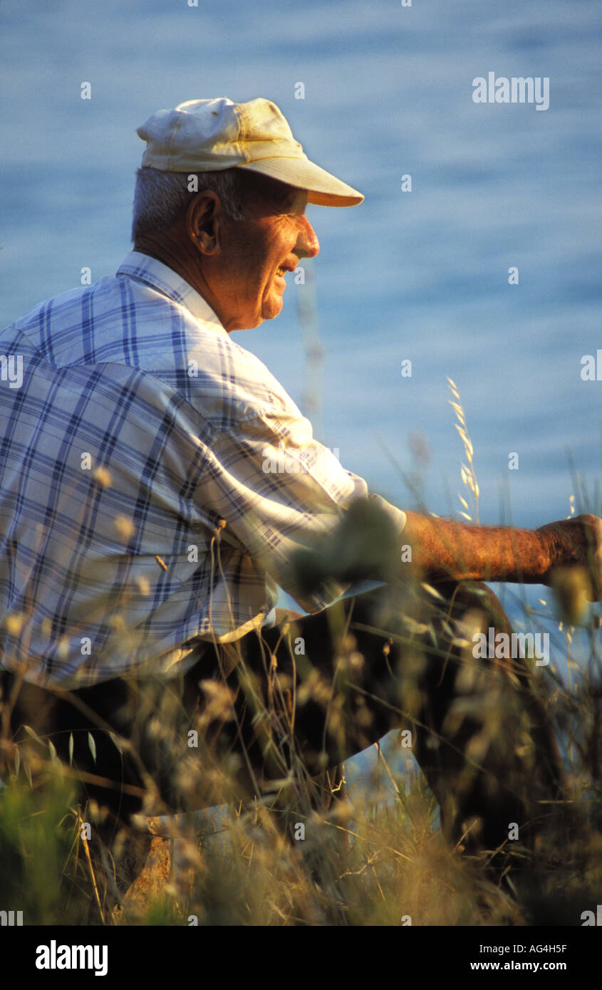 Greek man sitting Halkidiki Greece Europe Stock Photo - Alamy