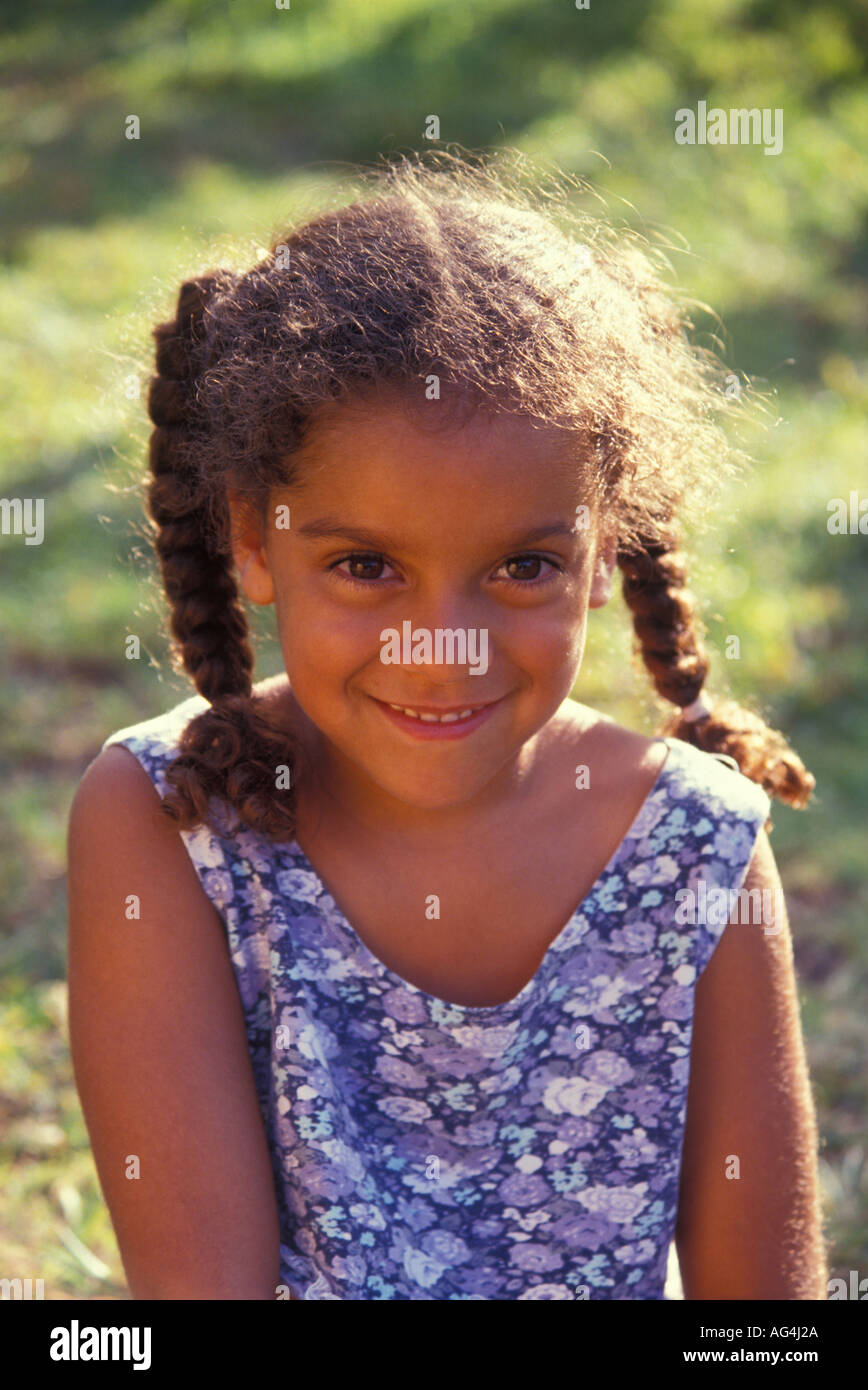 A pretty African American girl smiles with pigtails in her hair Stock ...