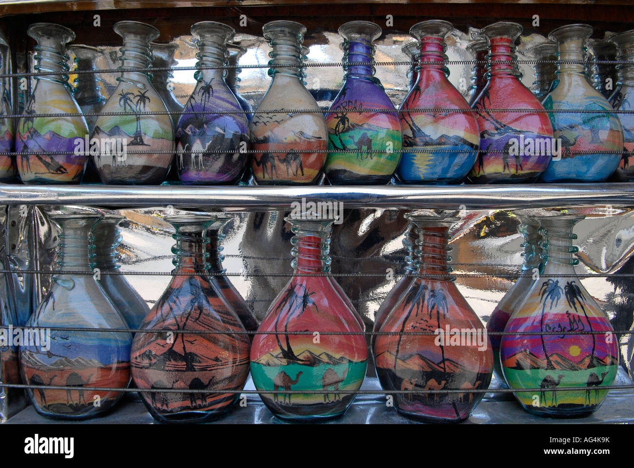 Stack of sand bottles with different kinds of coloured sand taken from ...