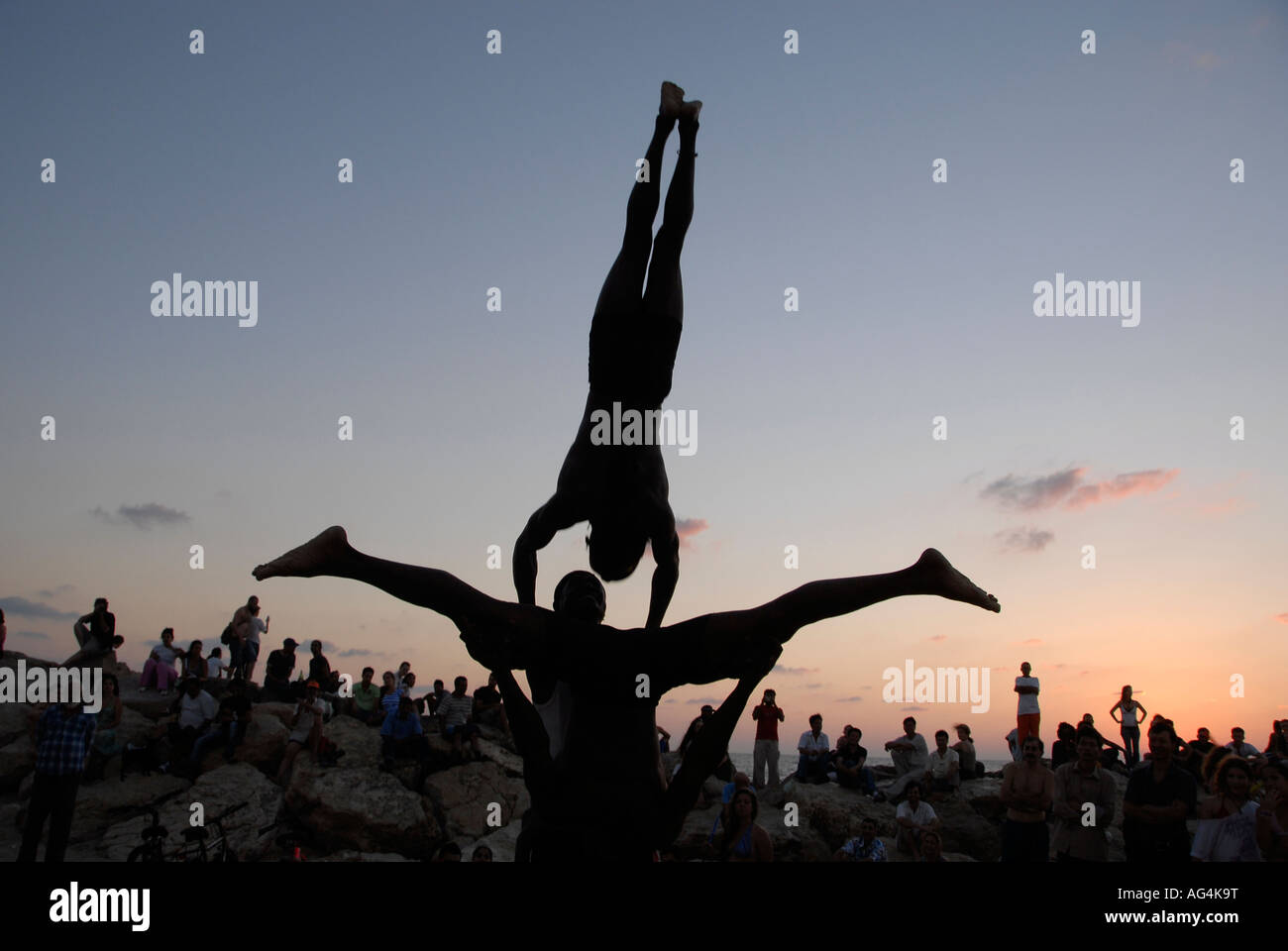 Young African men performing handstand balancing in Banana Beach also ...