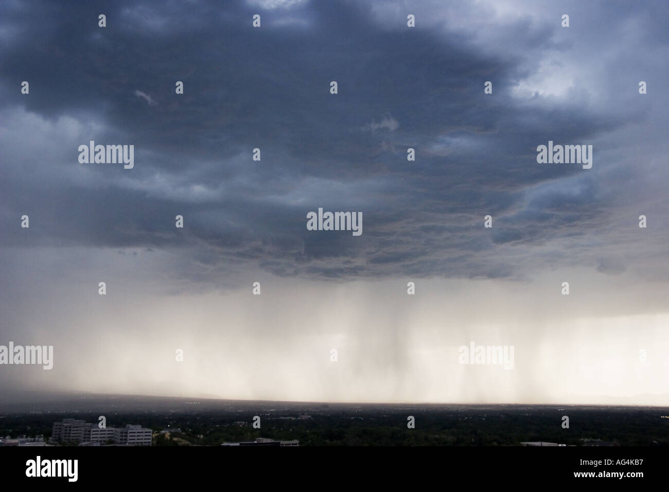 Rain and thunder storm seen approaching from a distance Stock Photo - Alamy