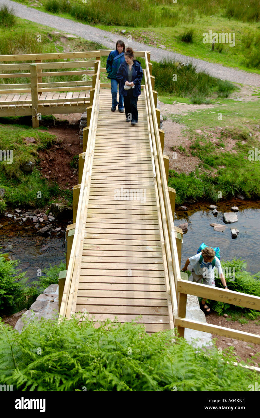 Wooden bridge over stream on Beacons Way walking route to Pen y Fan ...