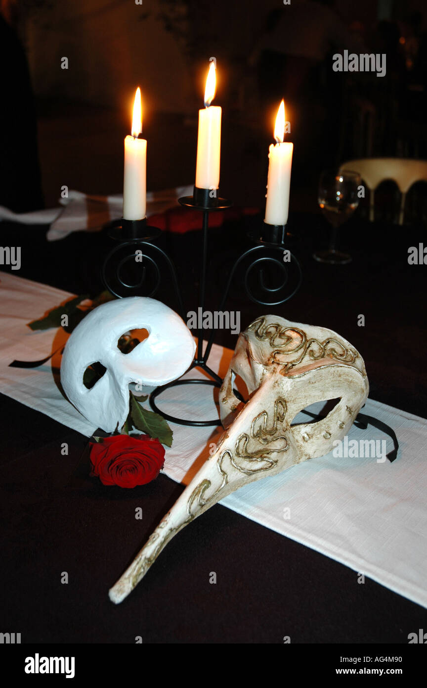 Phantom of the opera mask at masquerade ball with rose and candle Stock ...