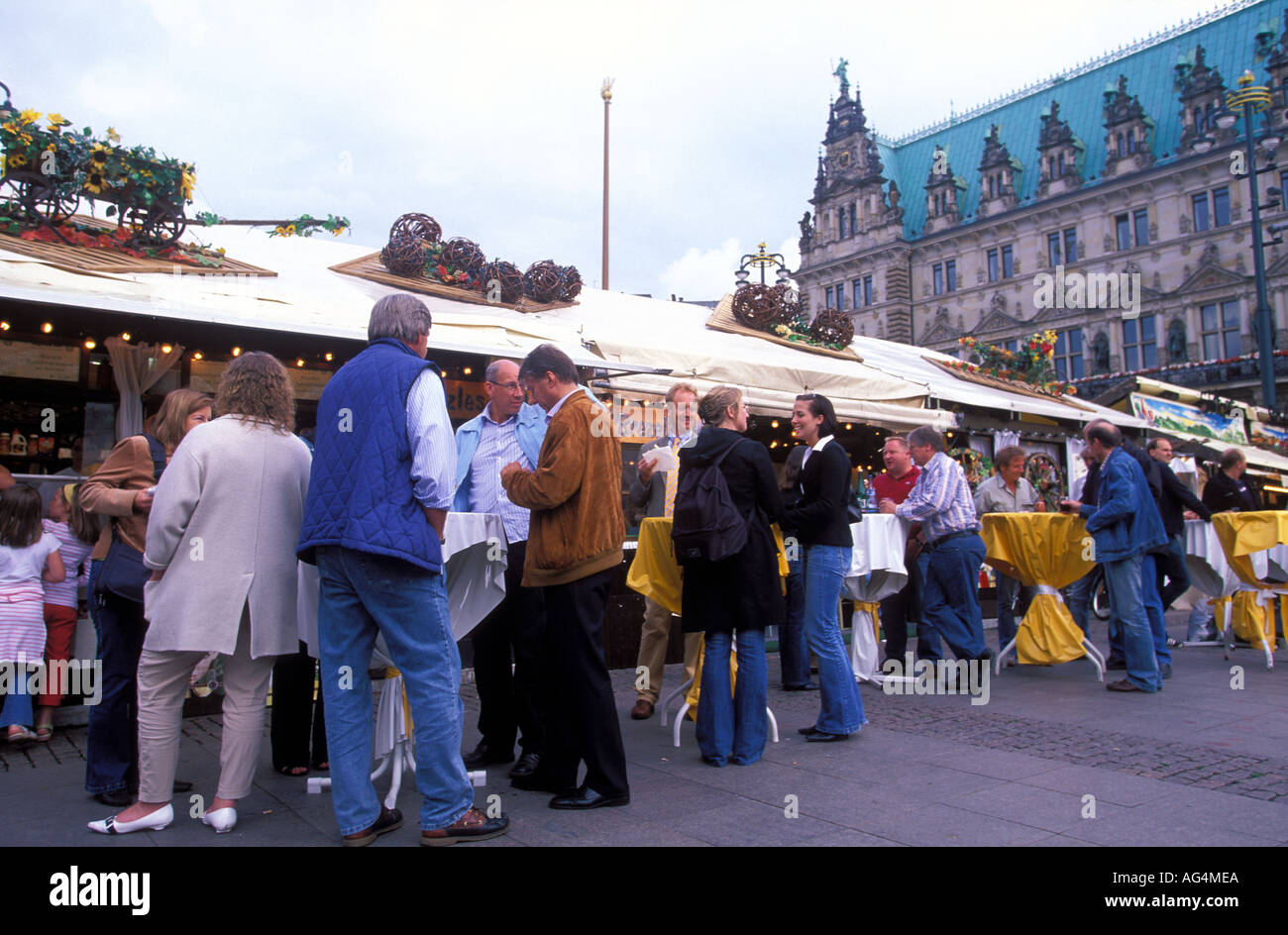Germany Hamburg People eating at a traditional food stall infront of ...
