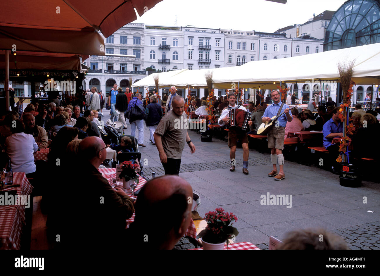Germany Hamburg People eating at a traditional food stalls infront of ...