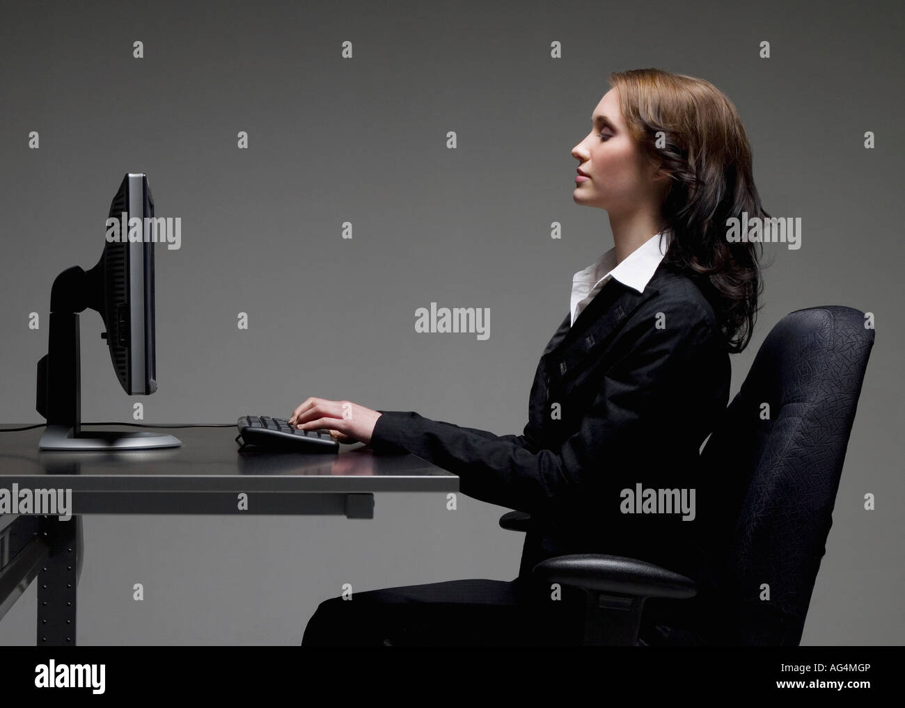 Woman typing computer sideview hi-res stock photography and images - Alamy