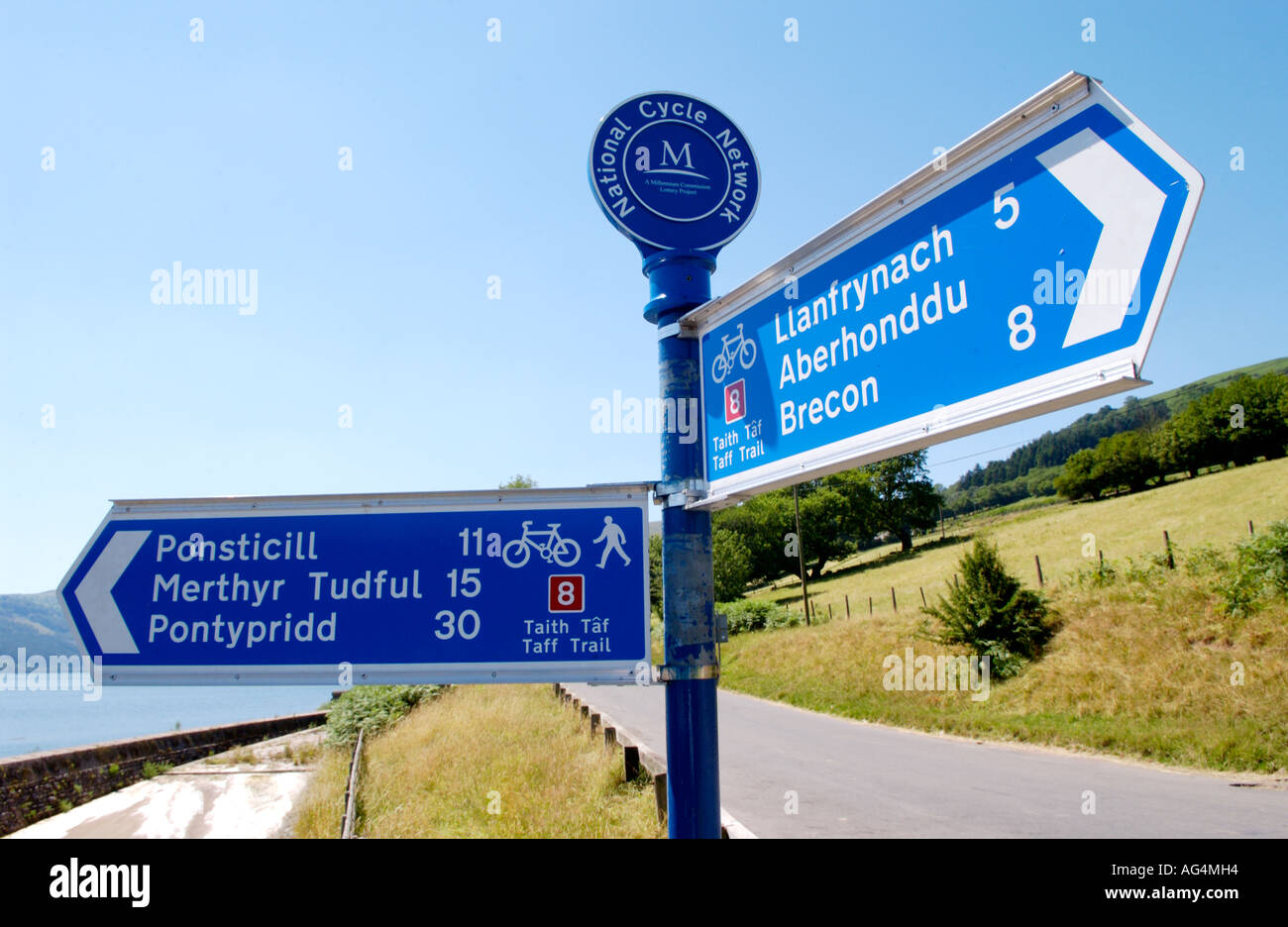 Blue road signs on the National Cycle Network at Talybont Reservoir in ...