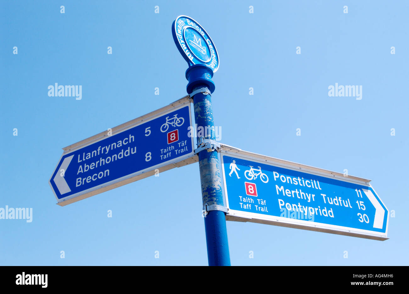 Blue road signs on the National Cycle Network at Talybont Reservoir in ...