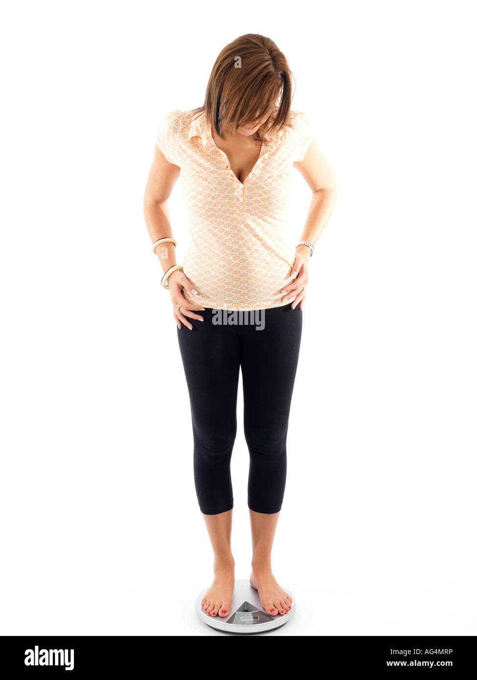 Woman using Scales Model Released Stock Photo - Alamy