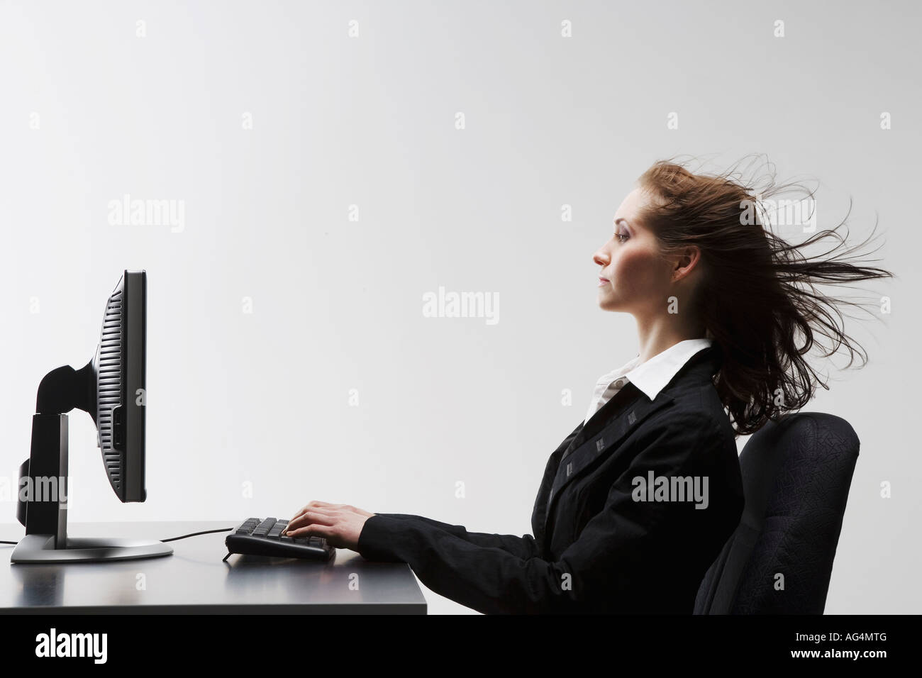 Woman using a computer Stock Photo - Alamy
