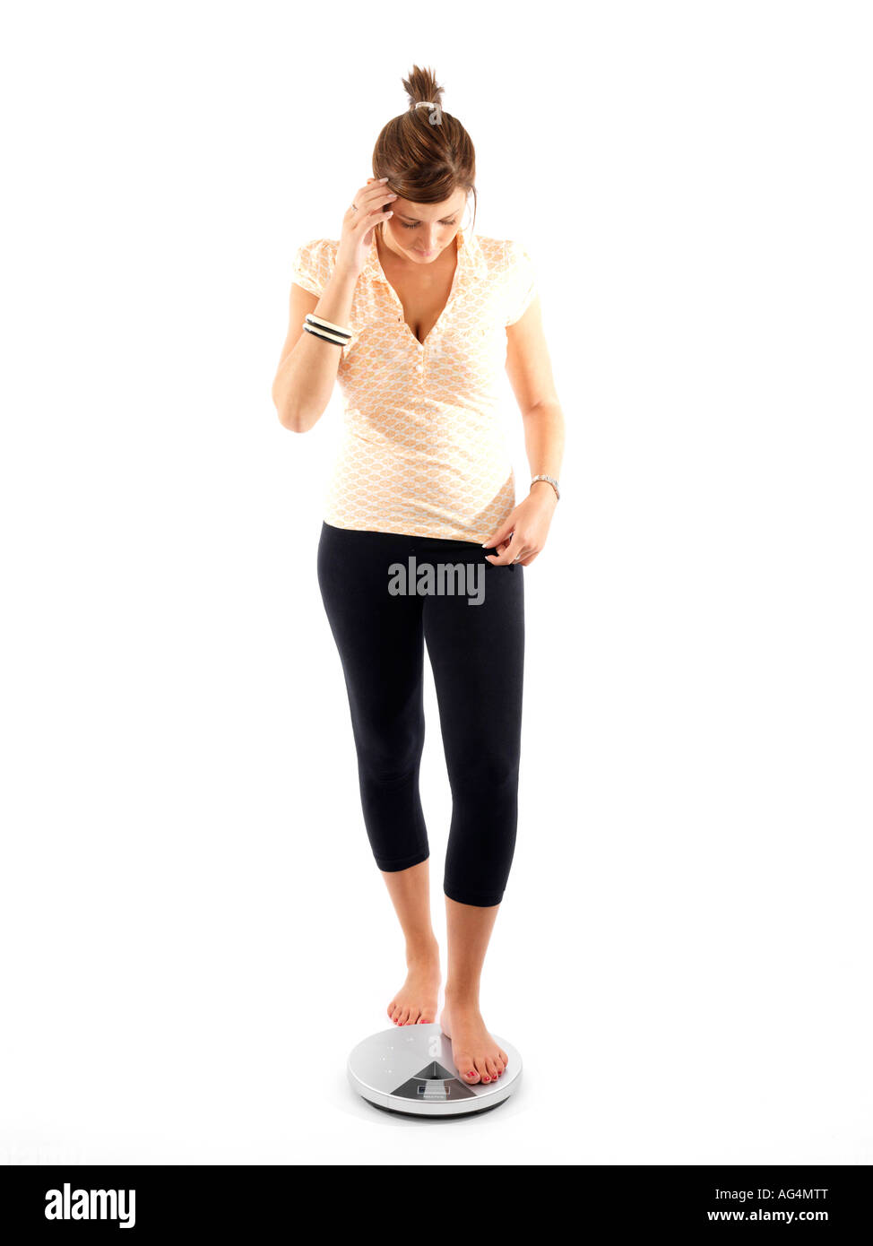 Woman using Scales Model Released Stock Photo - Alamy