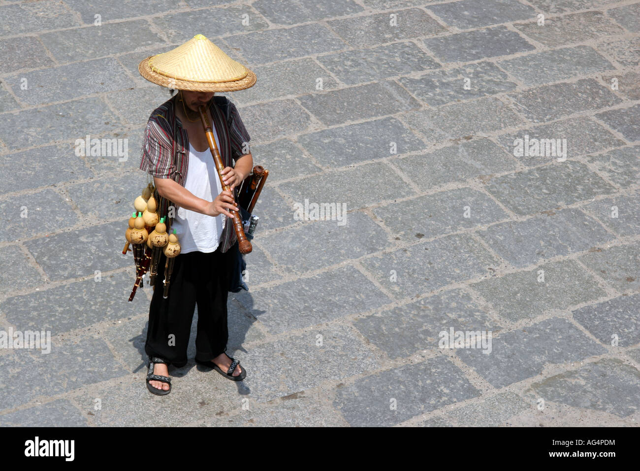 Traditional flute player in China Stock Photo - Alamy