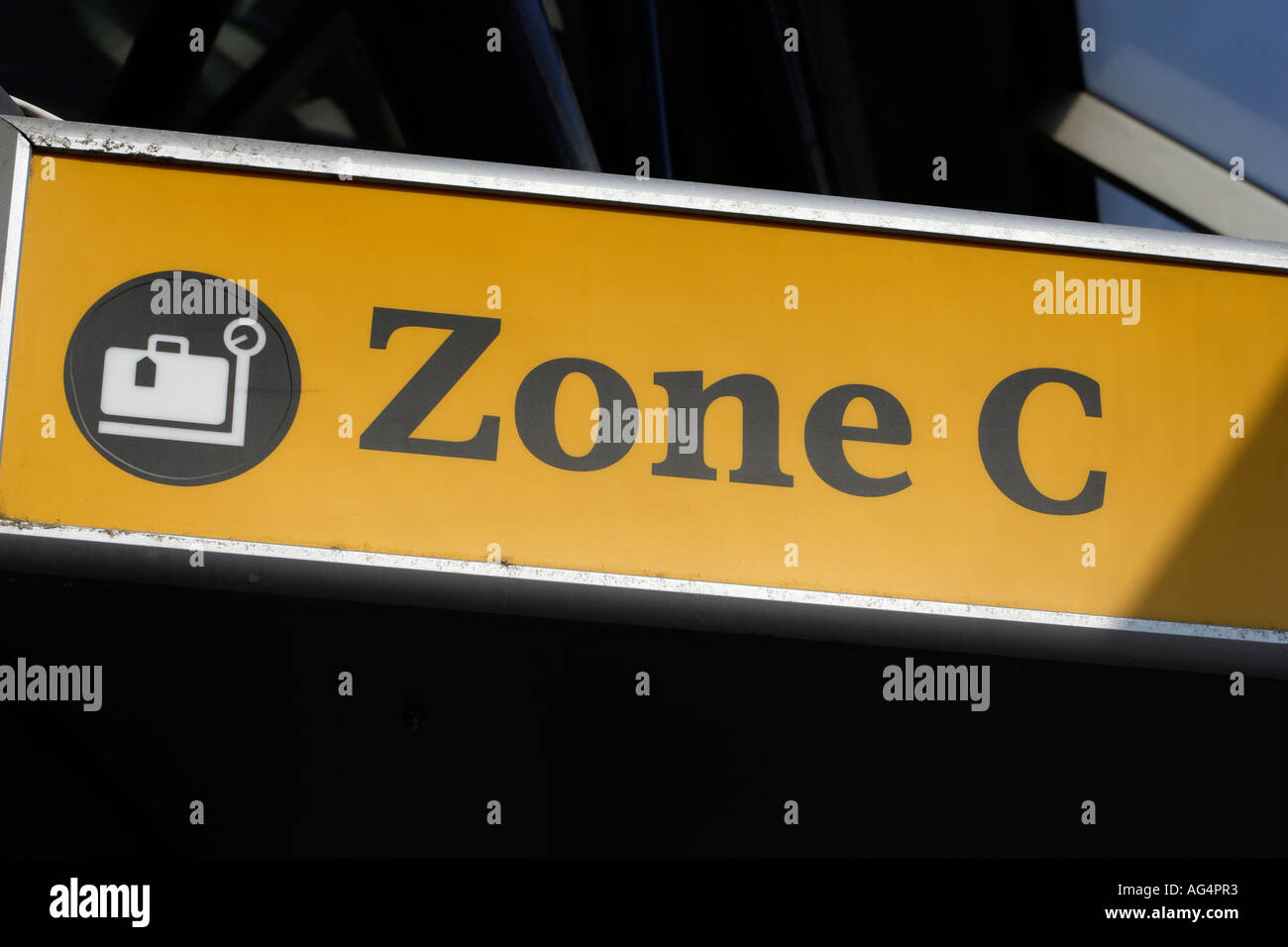 Zone C at an airport for baggage check in and weight Stock Photo - Alamy