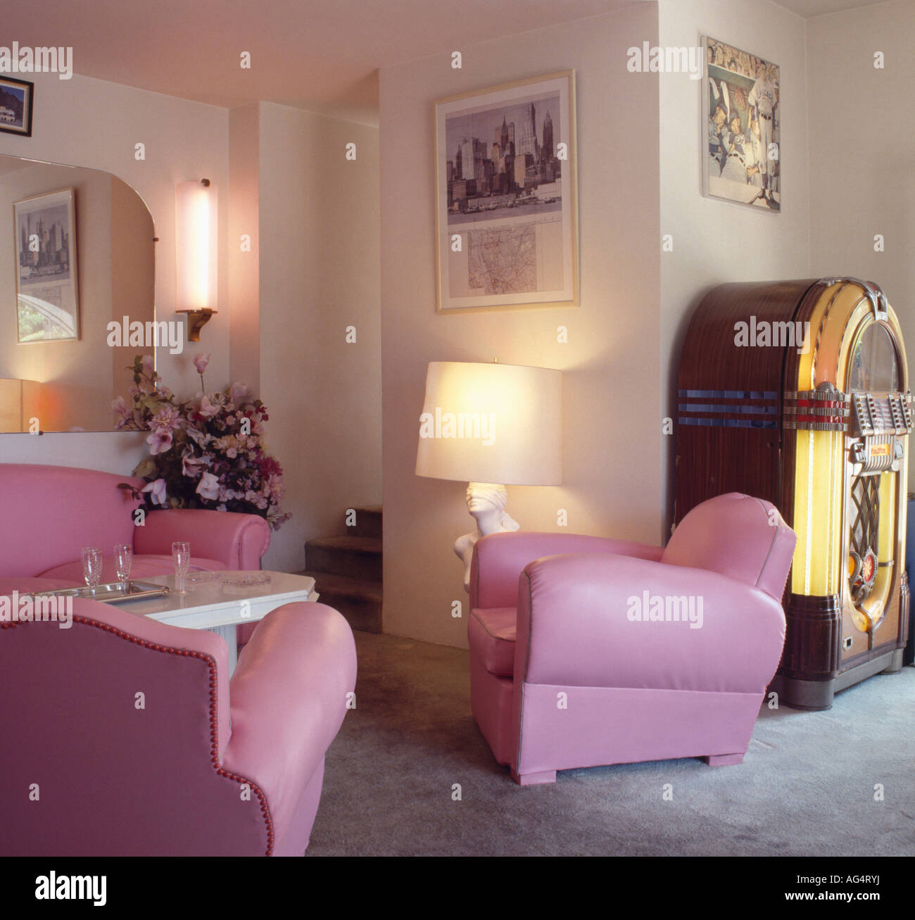 Pink leather thirties armchairs and Wurlitzer jukebox in apartment ...