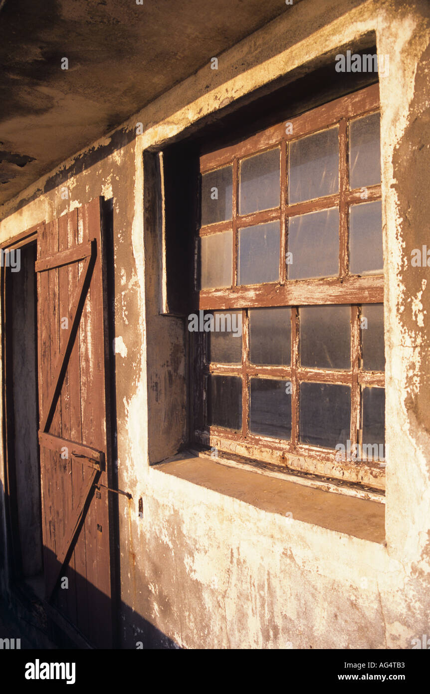 Weathered window and balcony door of hotel room at Fort Dauphin ...
