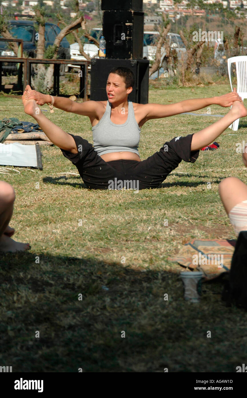 A female yoga instructor showing how it is done Stock Photo - Alamy