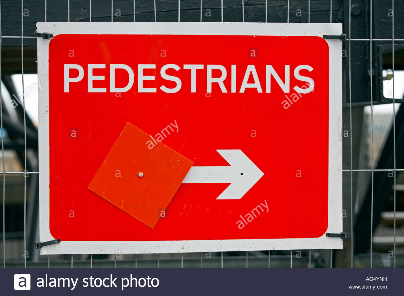 Pedestrians this way signpost Stock Photo - Alamy