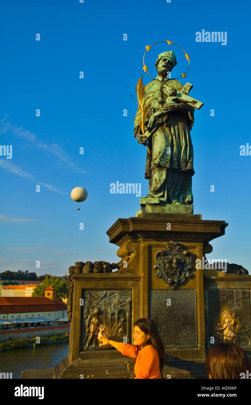 Statue of Saint John of Nepomuk on Charles Bridge in central Prague ...