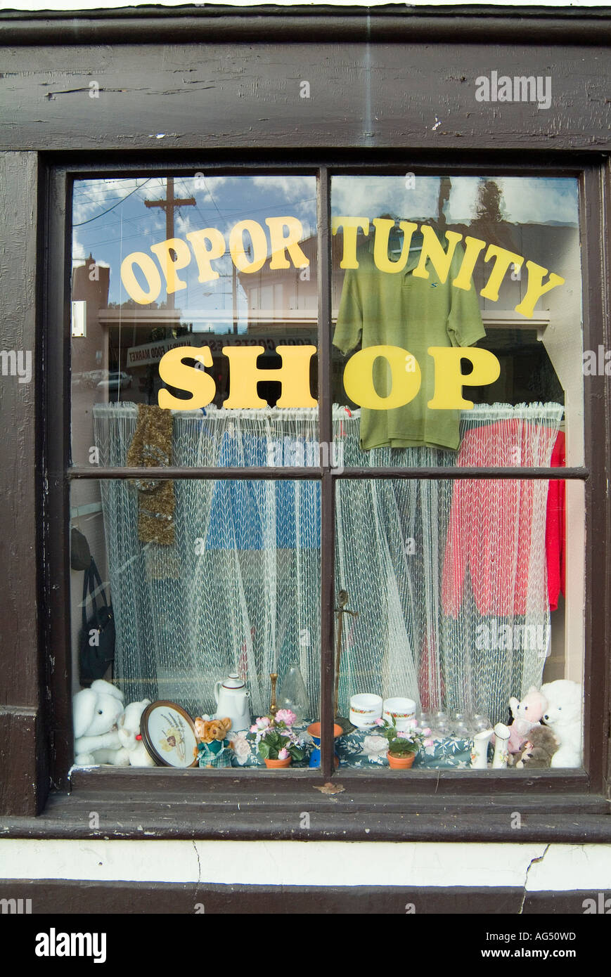 An opportunity shop window Stock Photo - Alamy