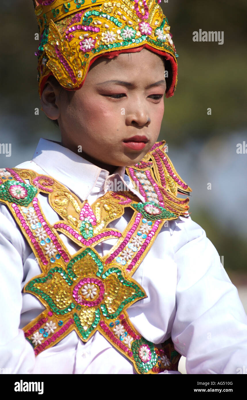 A young boy in traditional coustume takes place in a ceremoy where he ...