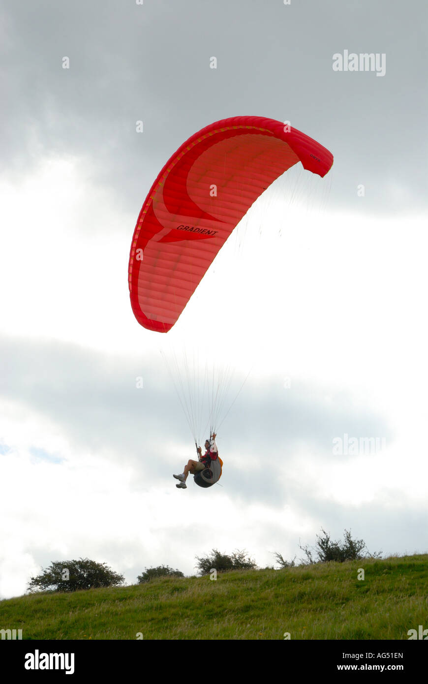 Launching Paraglider off country hill Stock Photo - Alamy