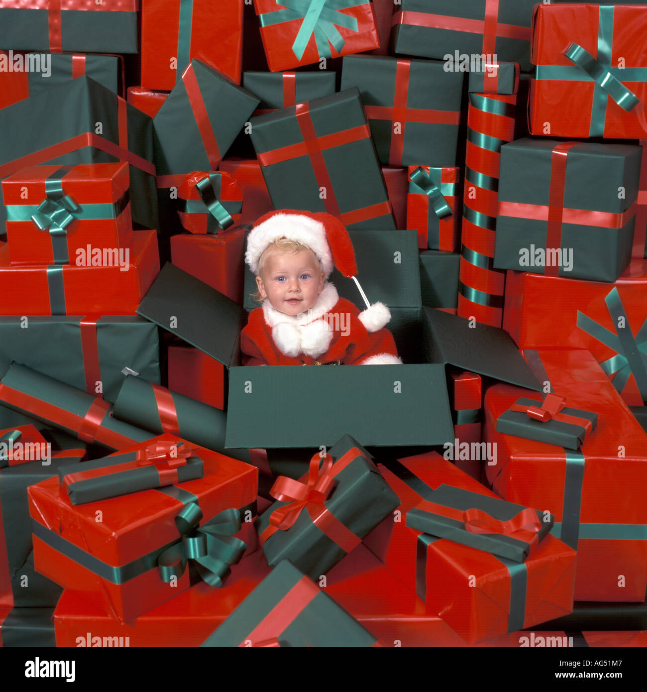 Santa Claus child hidden in a cristmas box Stock Photo - Alamy
