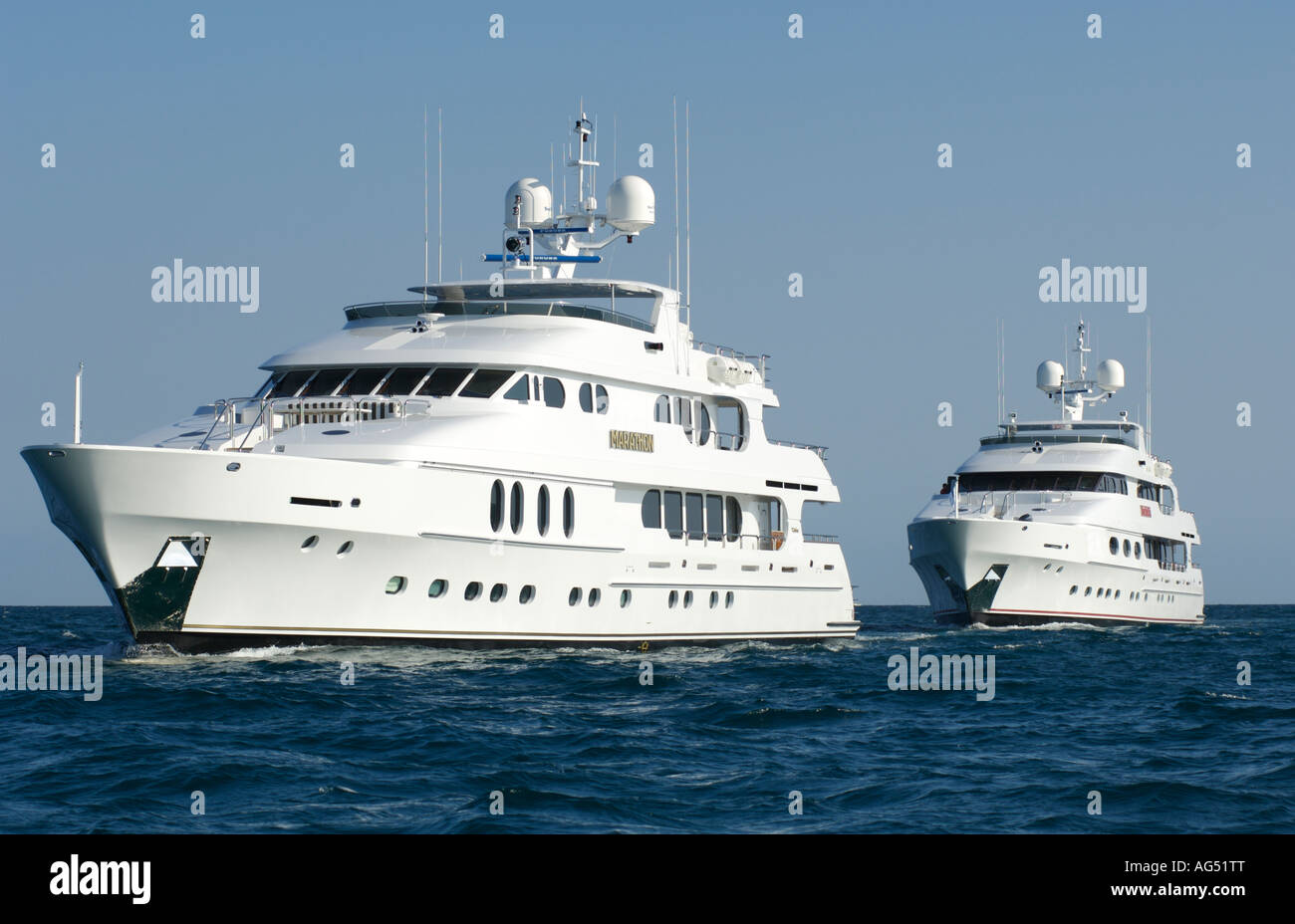 Two private yachts cruising Stock Photo - Alamy