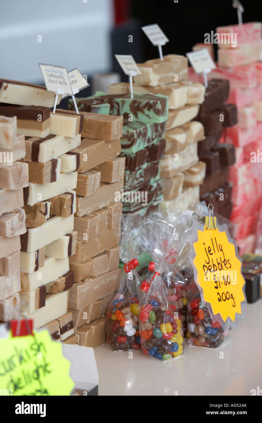 row of speciality fudge with names and sweets candies on a food stall ...
