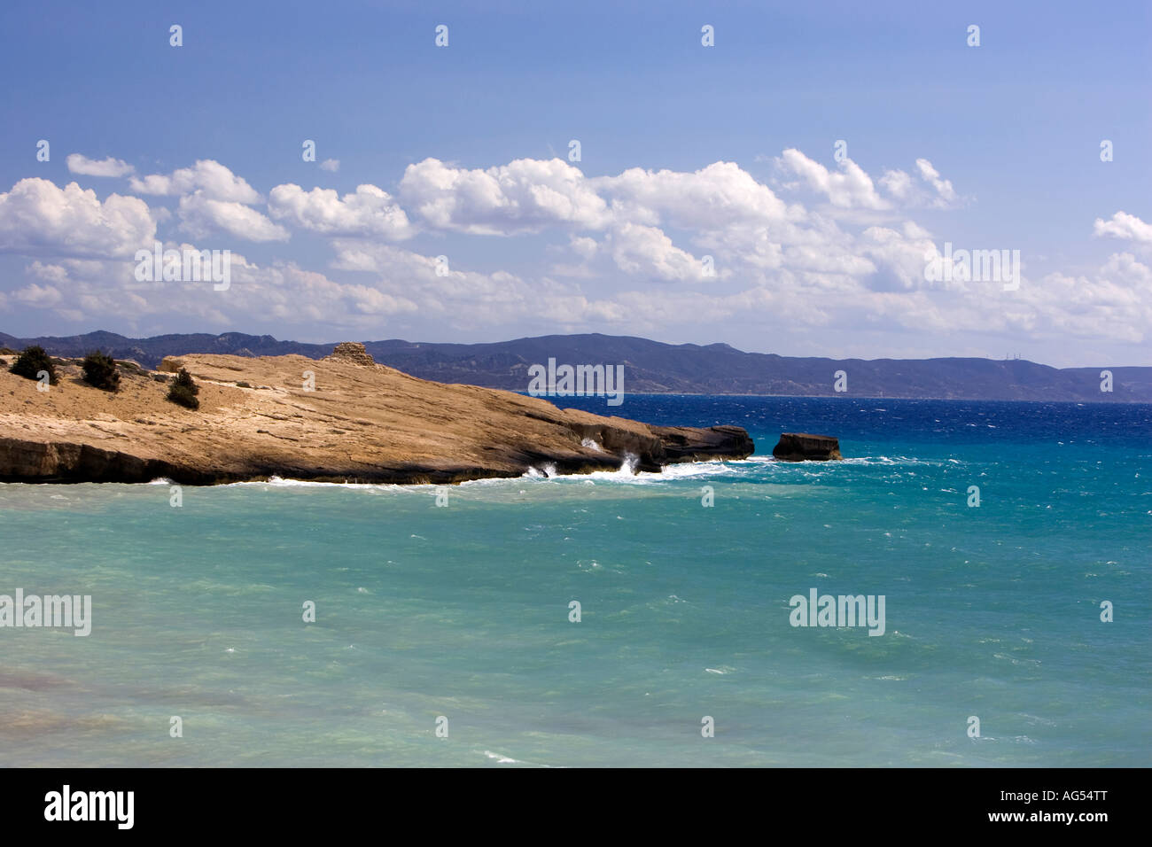 A rock peninsula by the beach at Fourni on the Aegean side of the Greek ...