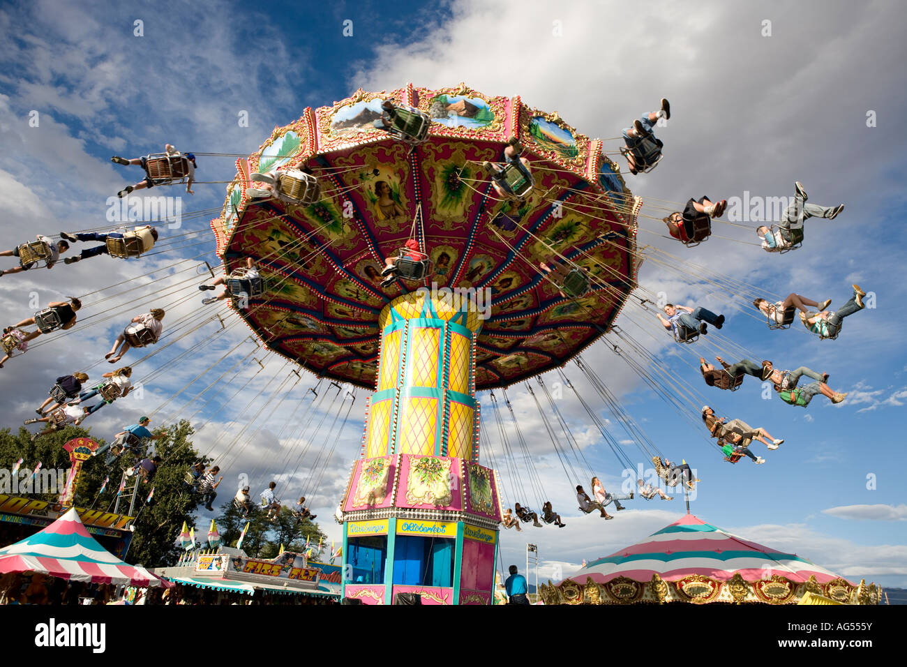 Family fun on high flying swing ride hi-res stock photography and ...