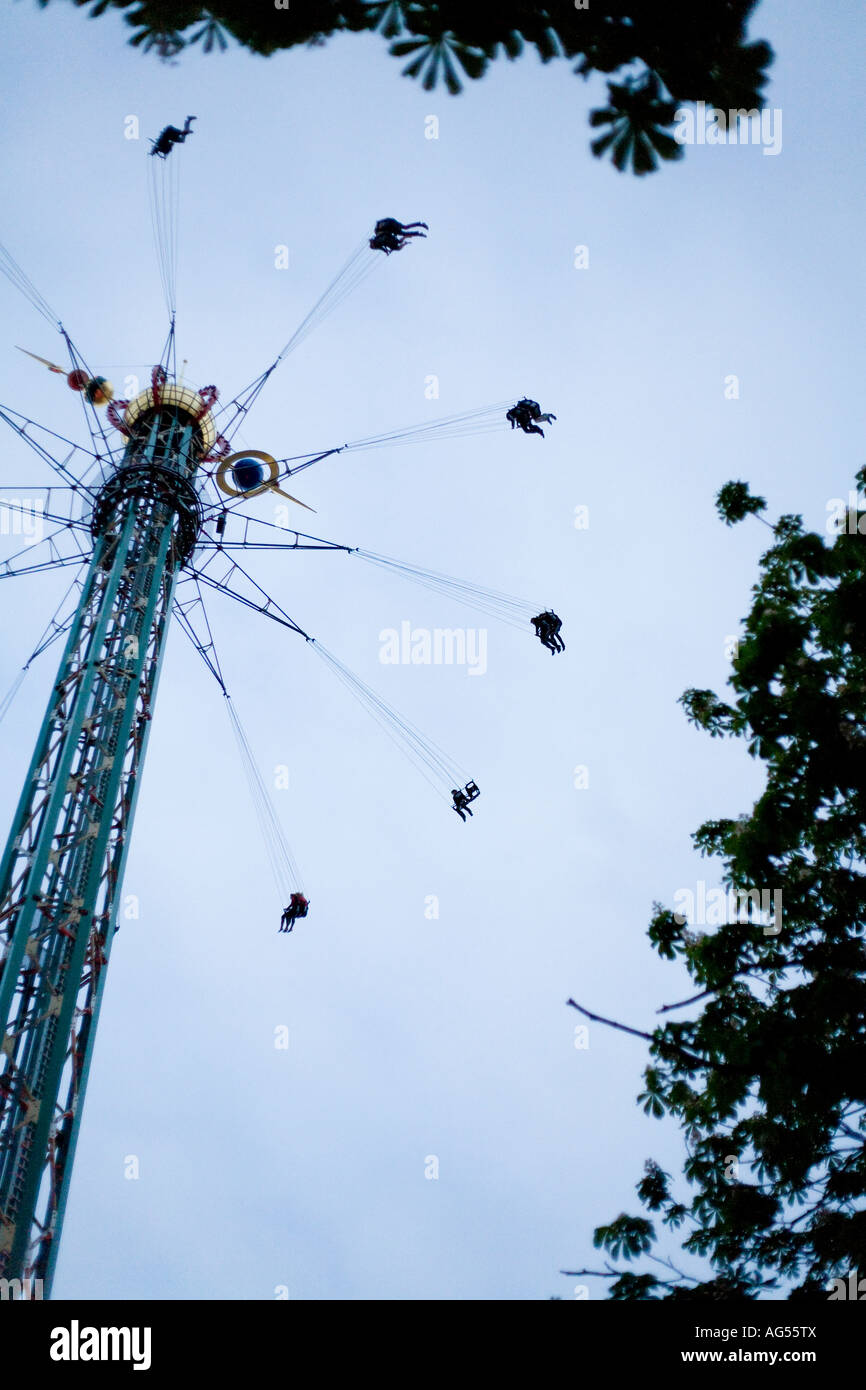The High Swing A popular Tivoli ride that swings people while hoisting ...