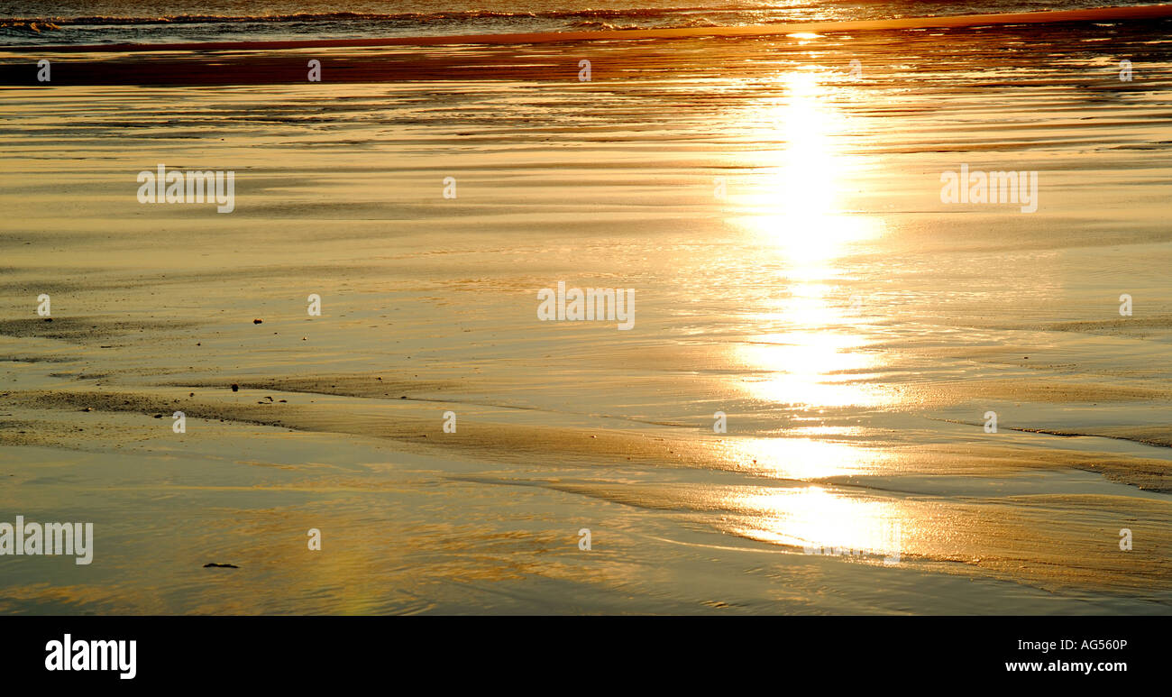 Sunrise patterns on beach Stock Photo - Alamy
