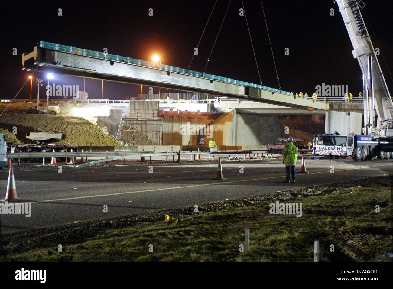 Bridge Building at Night Section being Lifted over Motorway Stock Photo ...