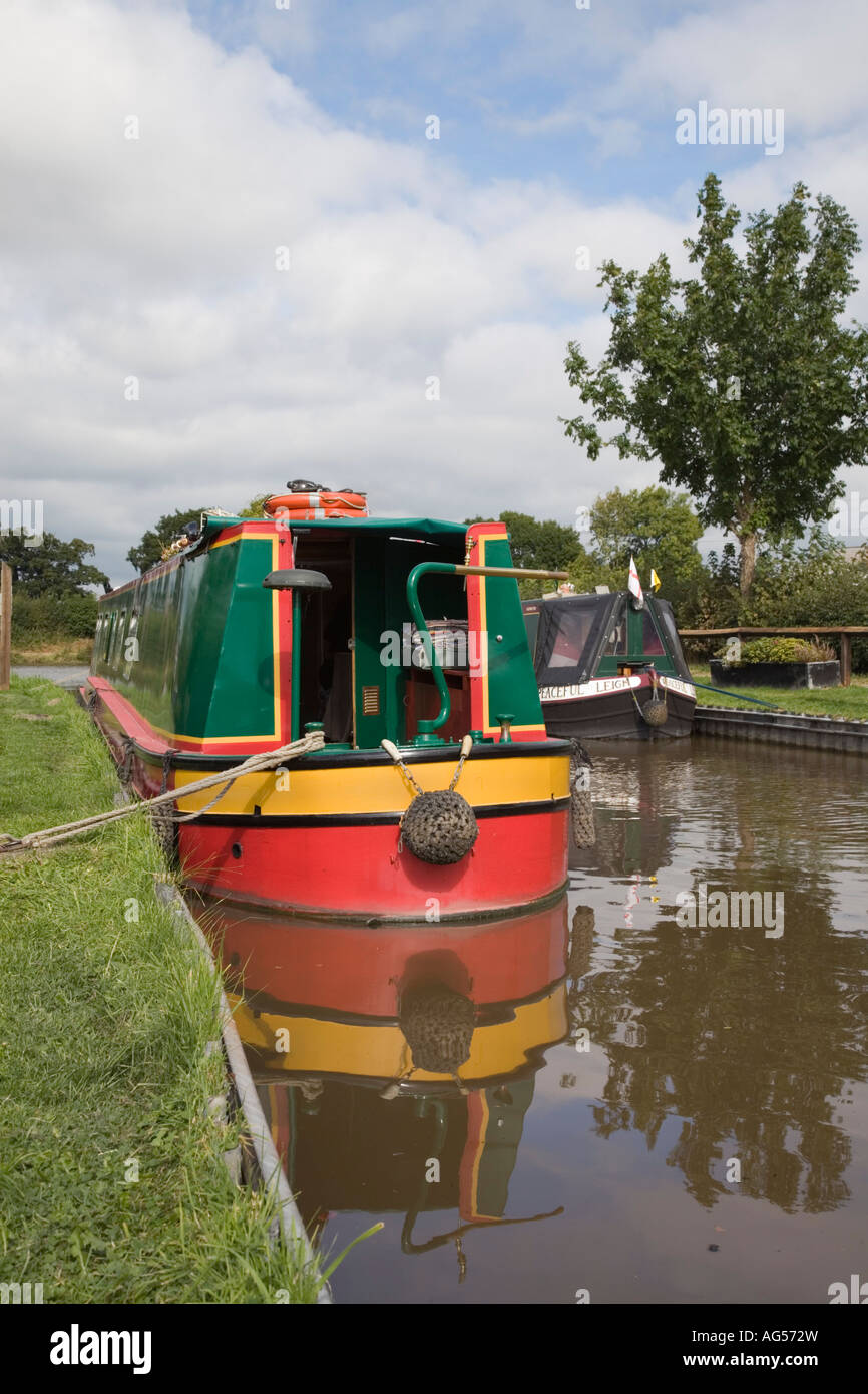 Colourful green yellow and red narrowboat moored on Montgomery Canal ...