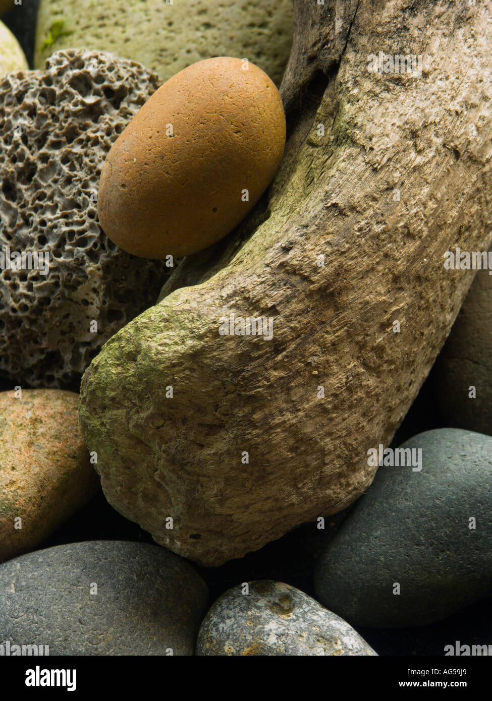 sea washed wood and pebbles Stock Photo - Alamy