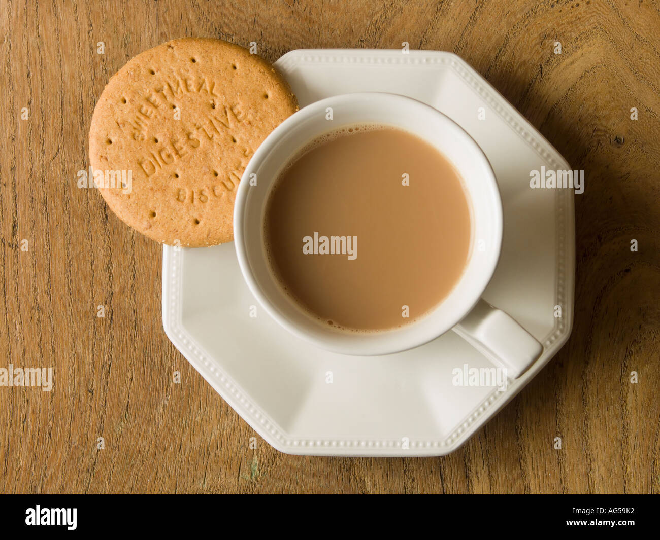 Cup of tea and digestive biscuit on a rustic wooden background Stock ...